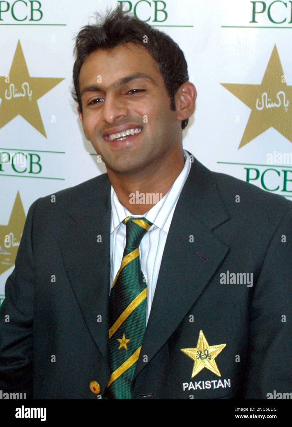 Newly appointed skipper of Pakistani cricket team Shoaib Malik smiles ...