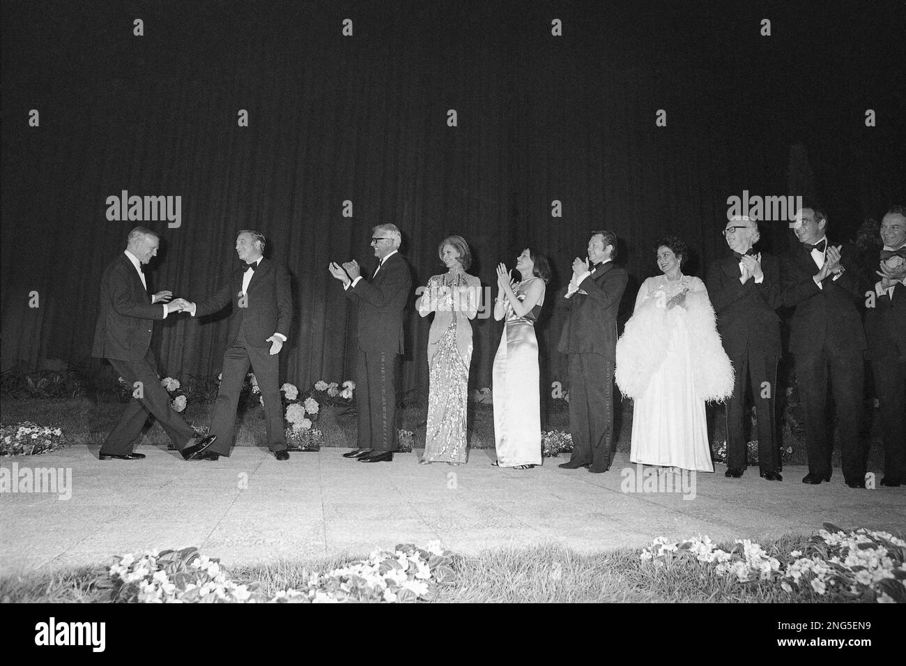 From left, actors Fred Astaire, Gene Kelly, Cary Grant, Cyd Charisse ...