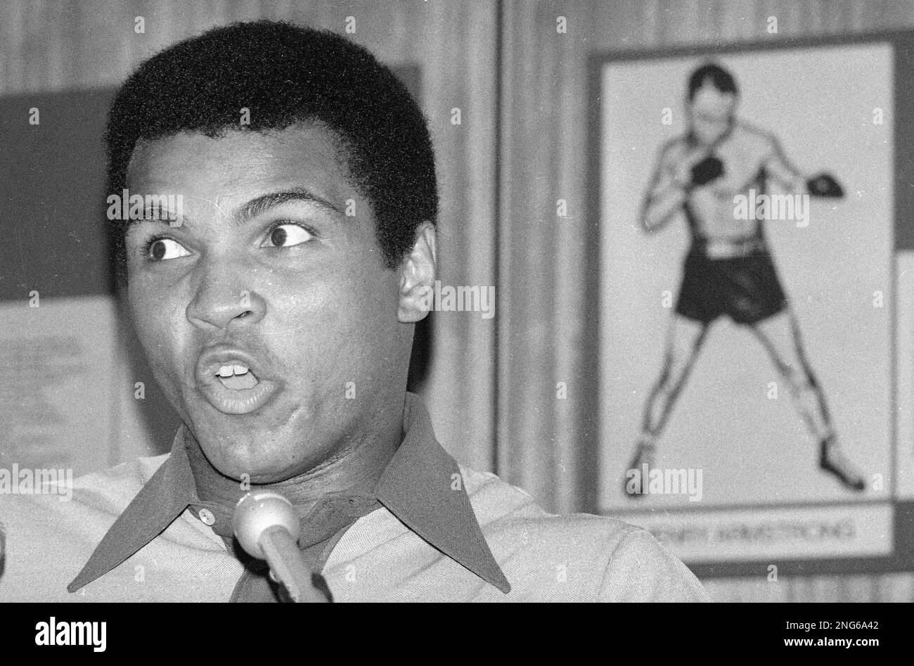 Boxer Muhammad Ali displays an array of facial calisthenics during a ...