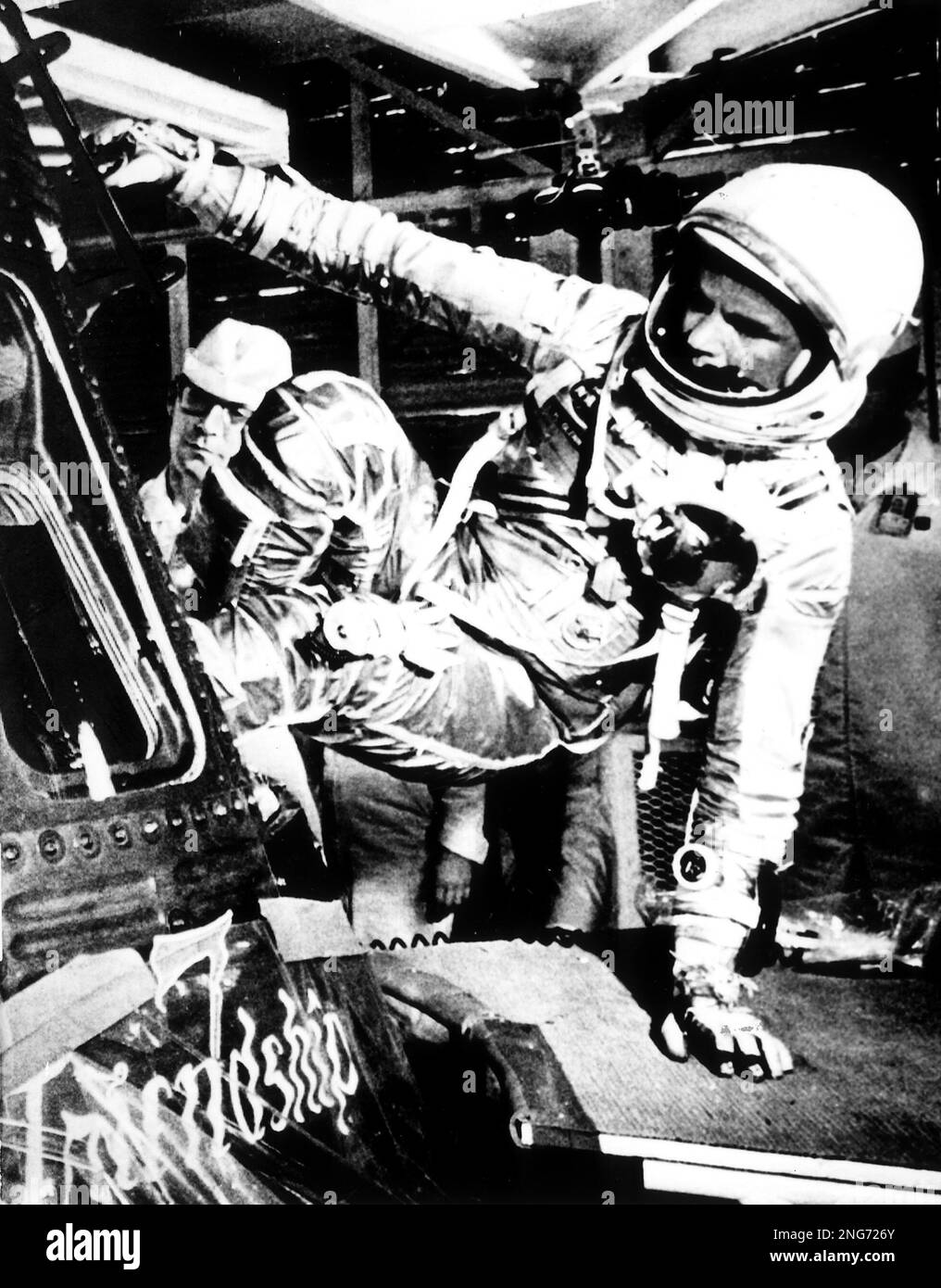 US astronaut John H. Glenn climbs inside the space capsule 'Friendship ...