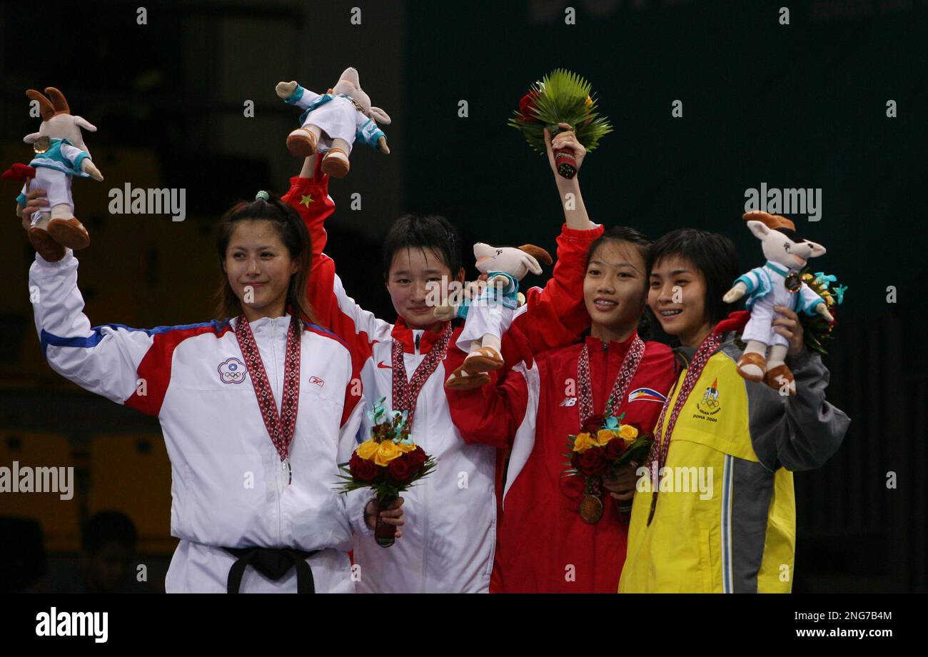From left to right, silver medalist Yang Shu Chun of Taiwan, gold ...