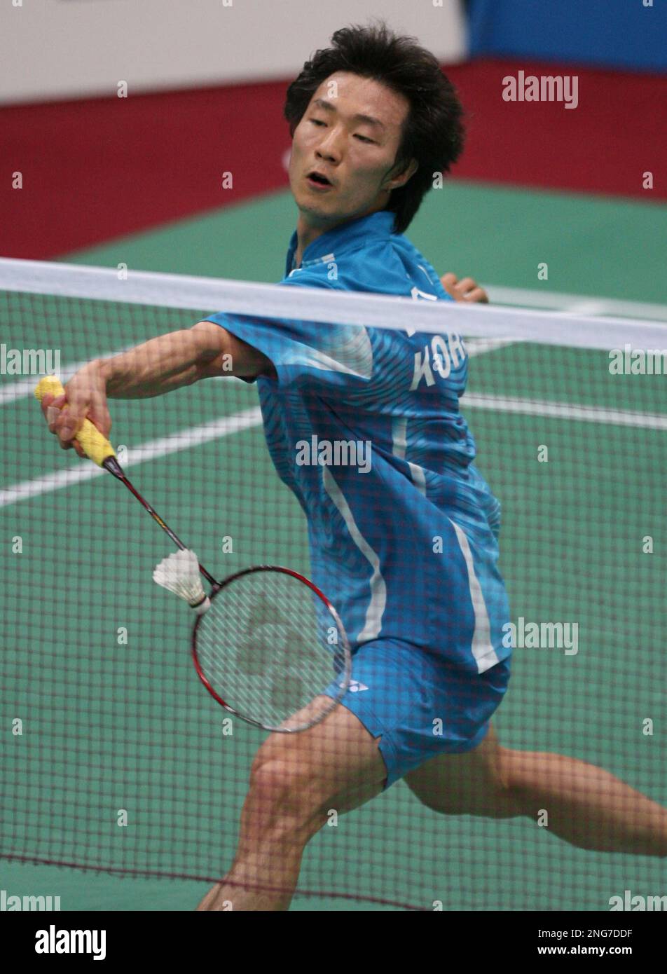 Lee Hyun-il of South Korea hits the shuttlecock during the Asian Games ...