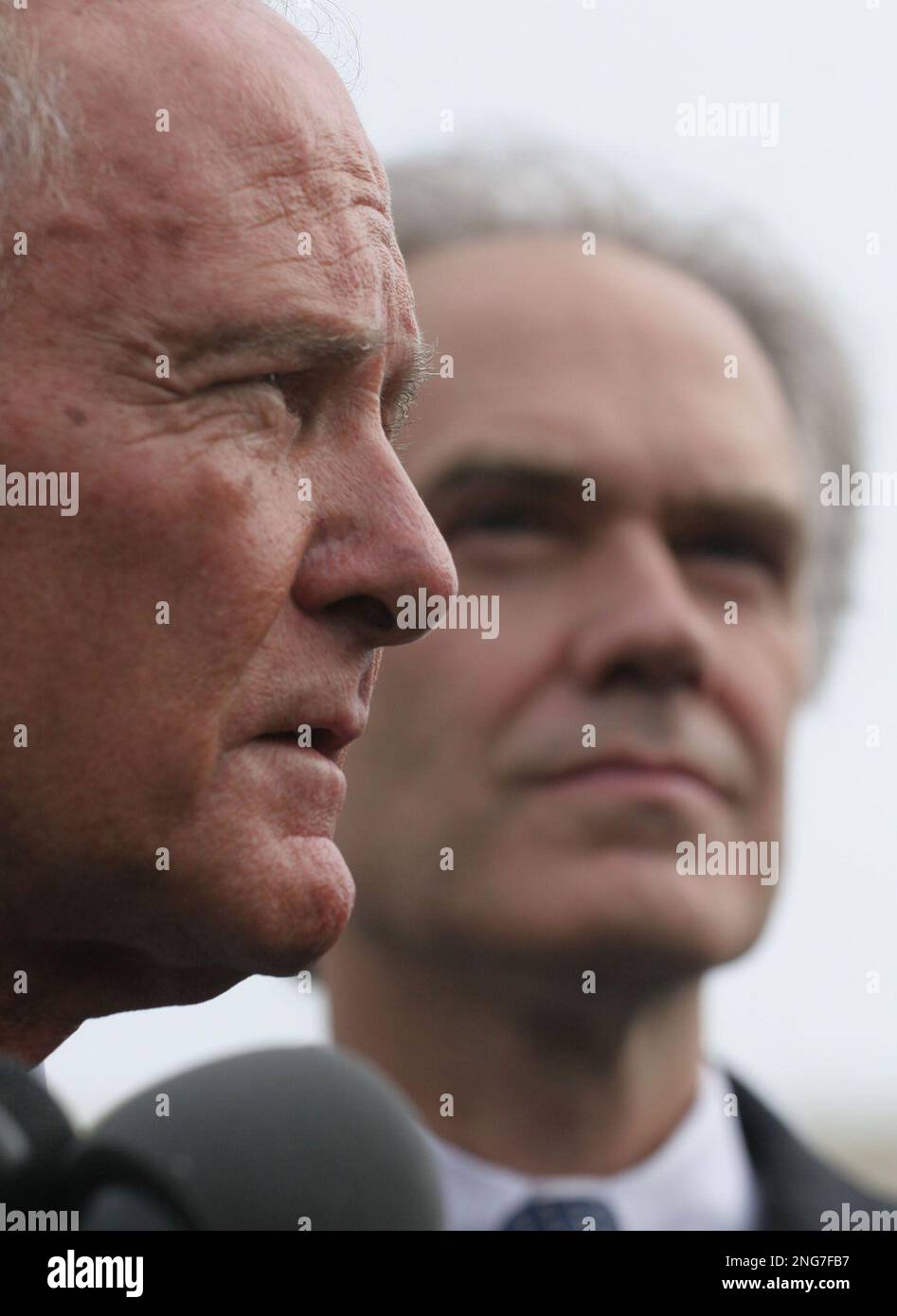 Massachusetts Attorney General Thomas Reilly, left, accompanied by ...