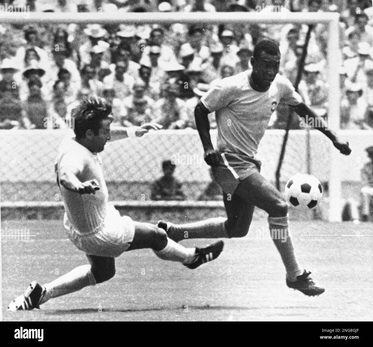 Brazil's football star Pele, right, avoids a challenge from England's ...