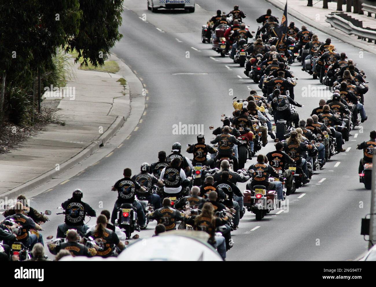A procession of bikers follows the casket of a Sydney gang leader after ...