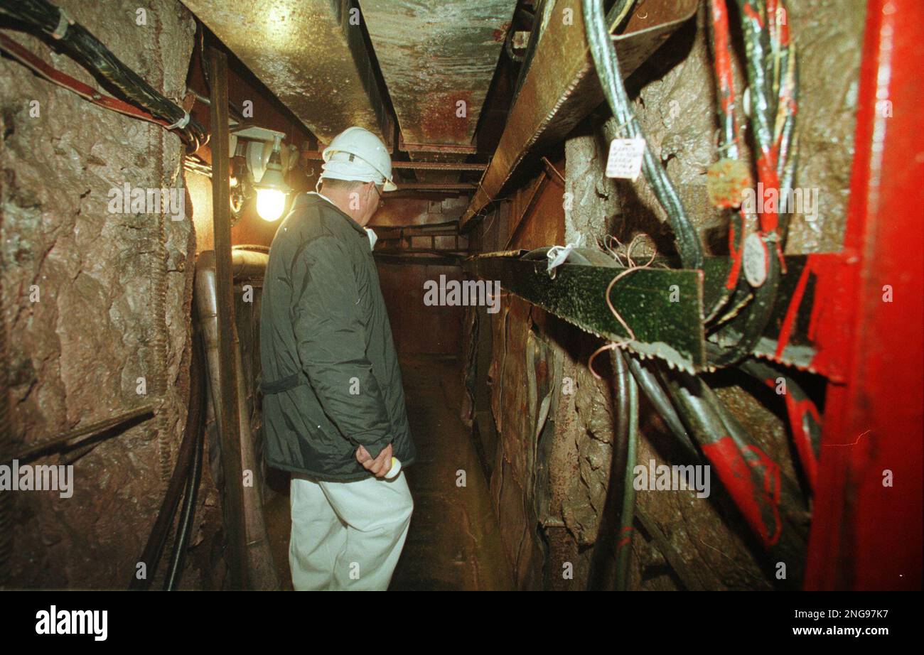 ** ADVANCE FOR Sunday April 23 ** FILE ** An investigator walks through ...