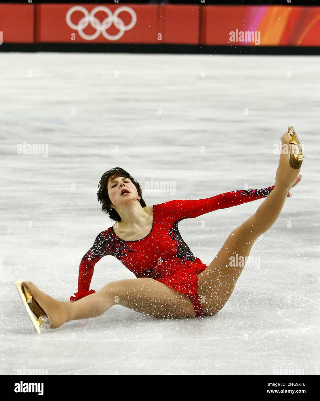 Bronze medalist Russia's Irina Slutskaya falls during her routine ...