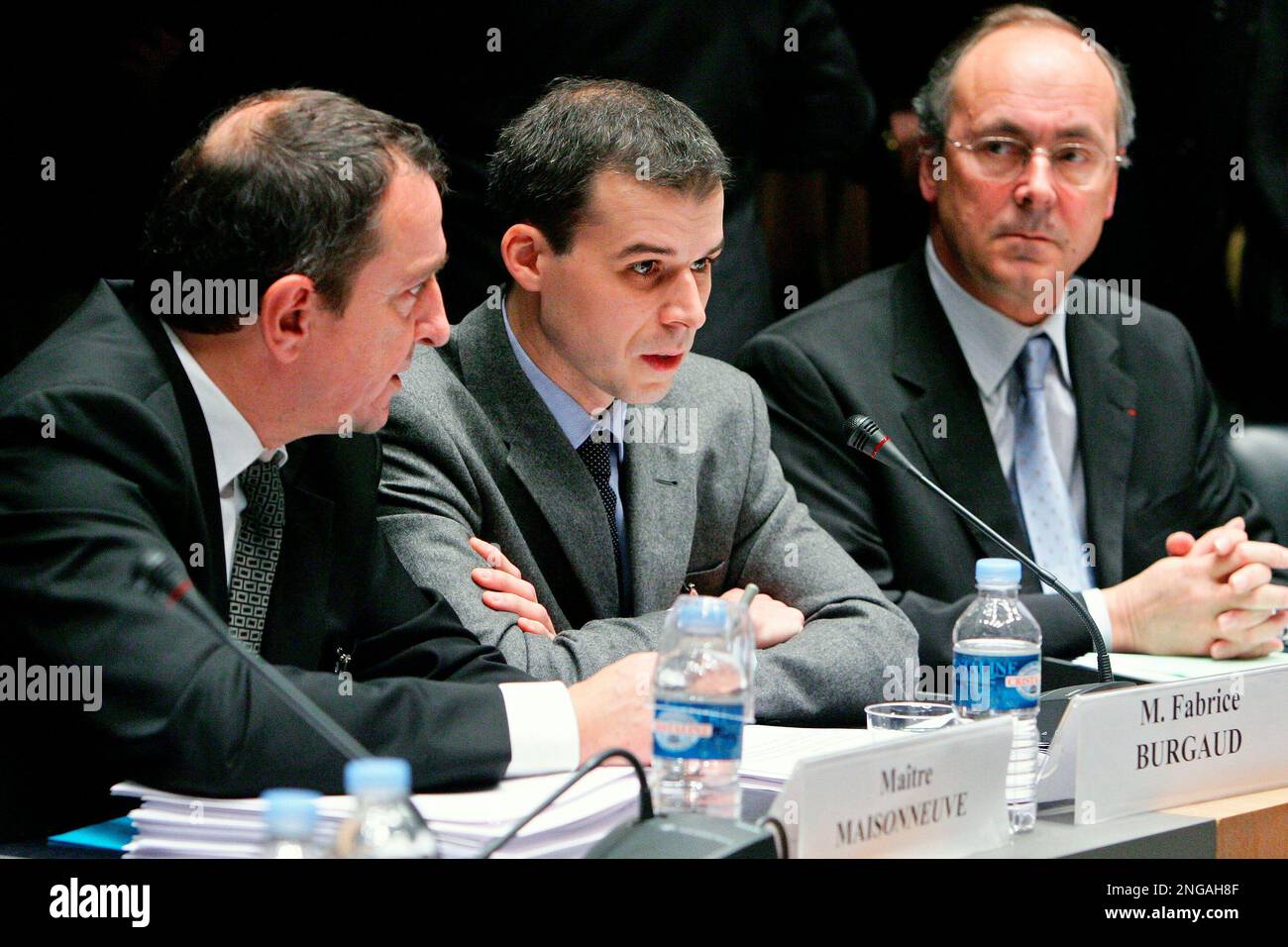 French judge Fabrice Burgaud, center, flanked by his lawyers Patrick ...
