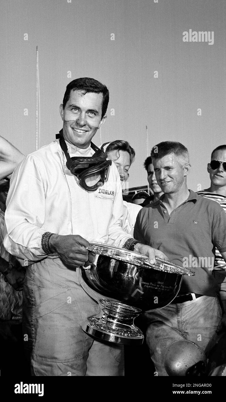 Roger Penske of Gladwyne, Pa., holds the Commonwealth Trophy after ...