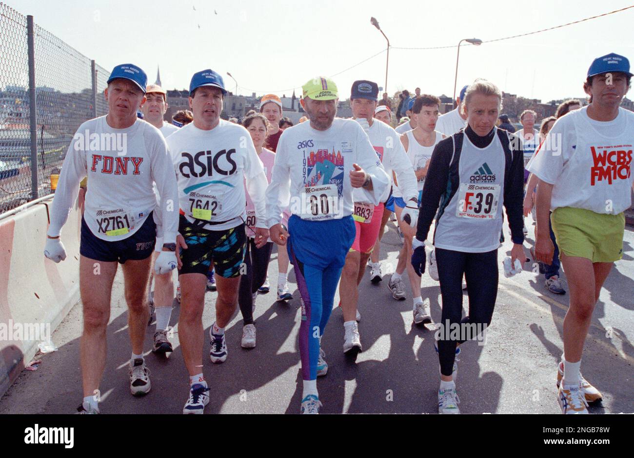 Fred Lebow (60) and Grete Waitz (F39) cross the Pulaski Bridge on the ...