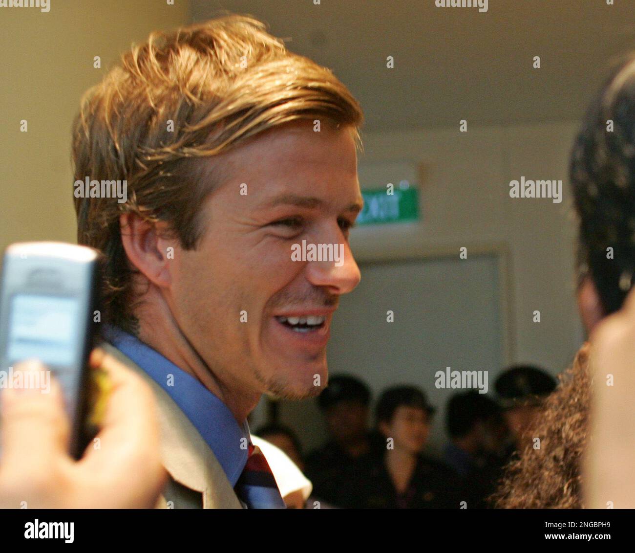 England's soccer star David Beckham speaks to reporters as he arrives ...