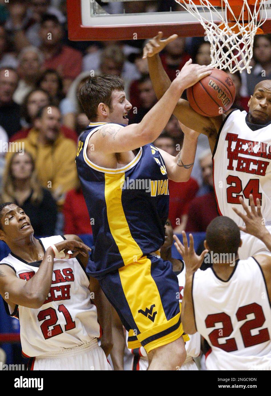 West Virginia center Kevin Pittsnogle brings down a rebound amid a host ...