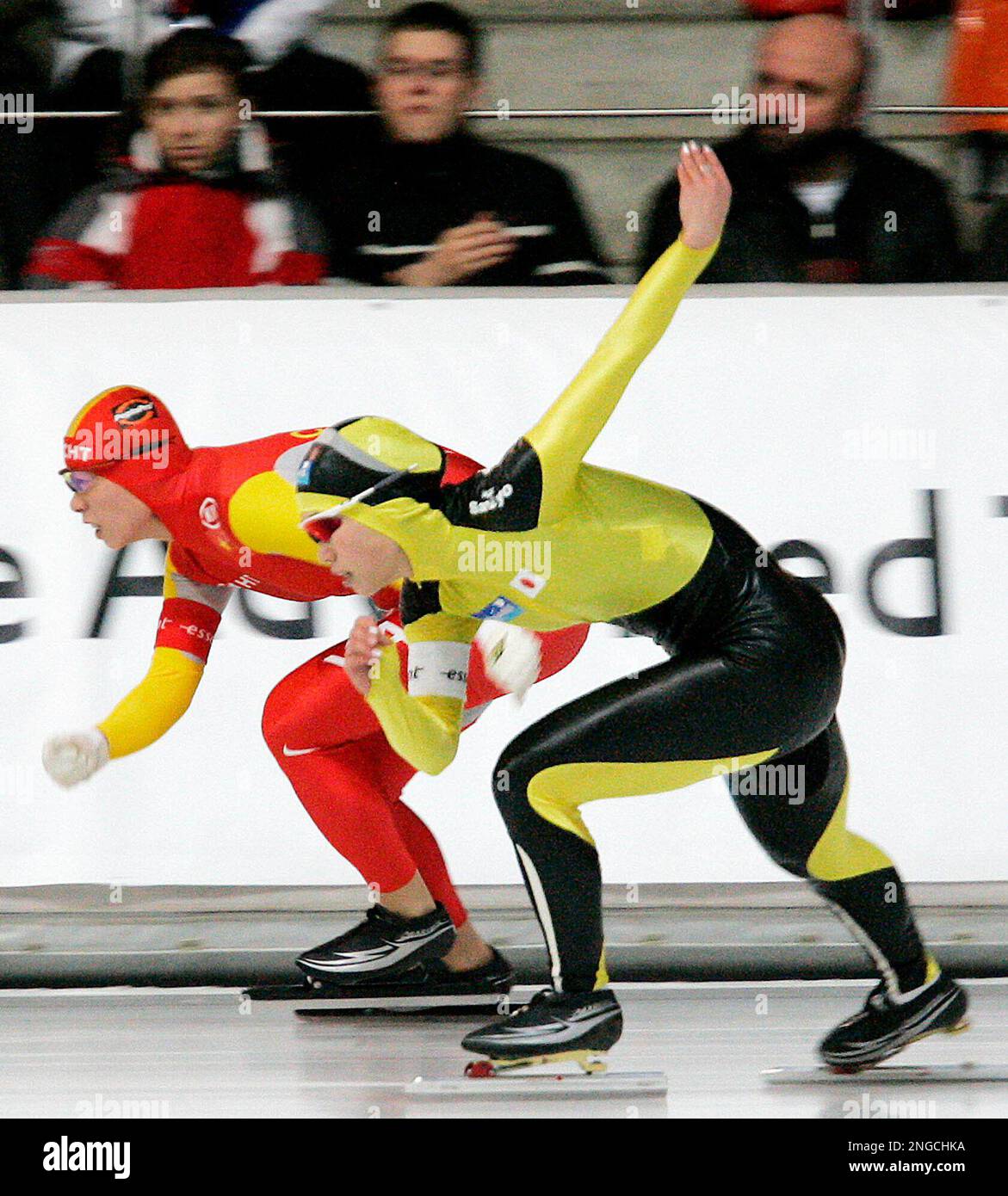 Manli Wang, of China, skates on her way to win the ladies 500 meters ...
