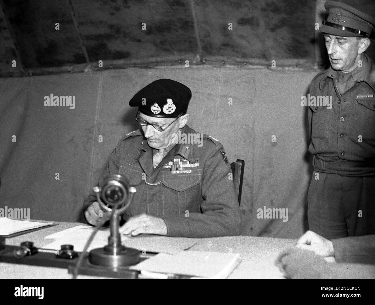 Britain's Field Marshal Bernard Montgomery signs the surrender pact, in ...