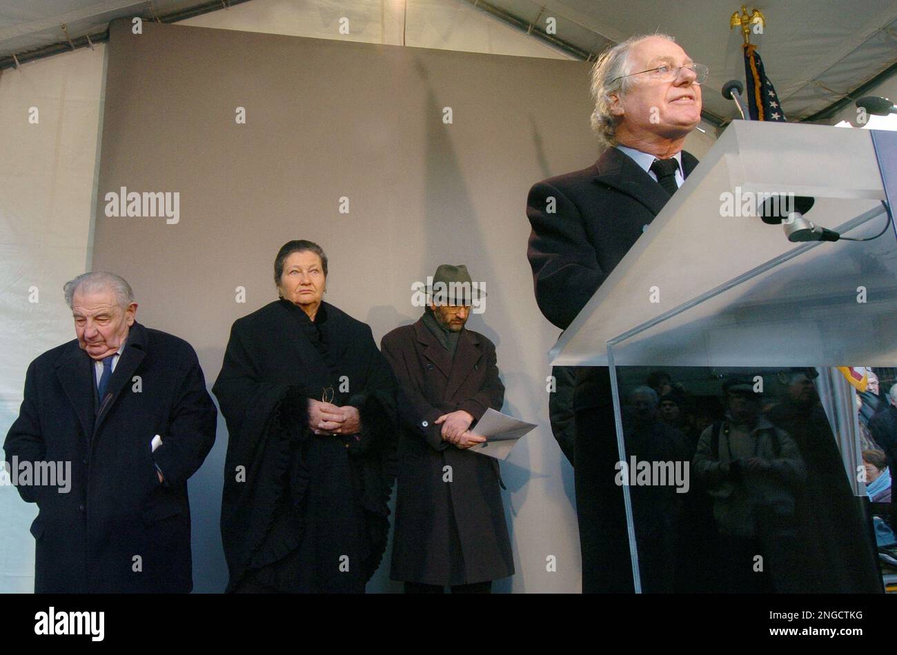 President of the Memorial Eric de Rothschild, right, delivers a speech ...