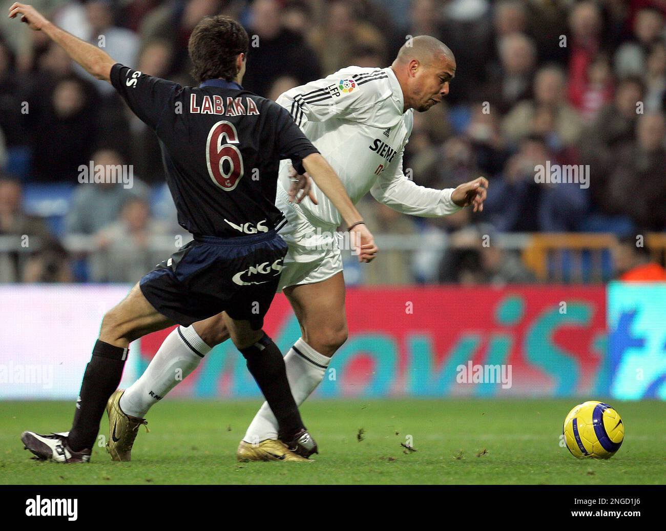 Real Madrid's Brazilian striker Ronaldo, right, is fouled in the box by ...