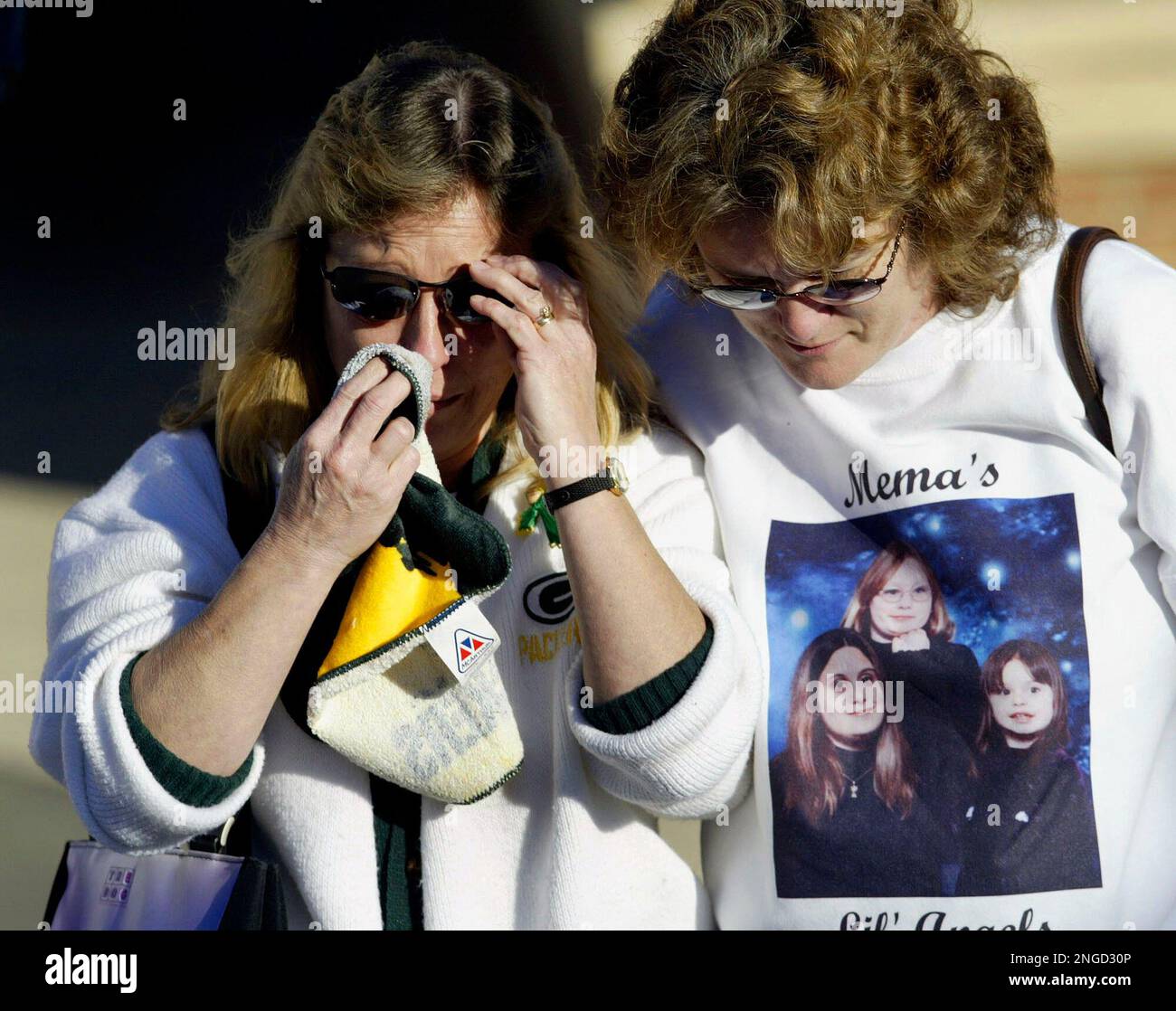 Unidentifed Green Bay Packers fans embrace as they leave the A.L ...