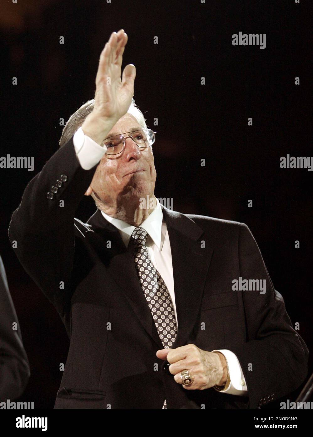 Former St. John's basketball coach Lou Carnesecca waves to fans at a ...