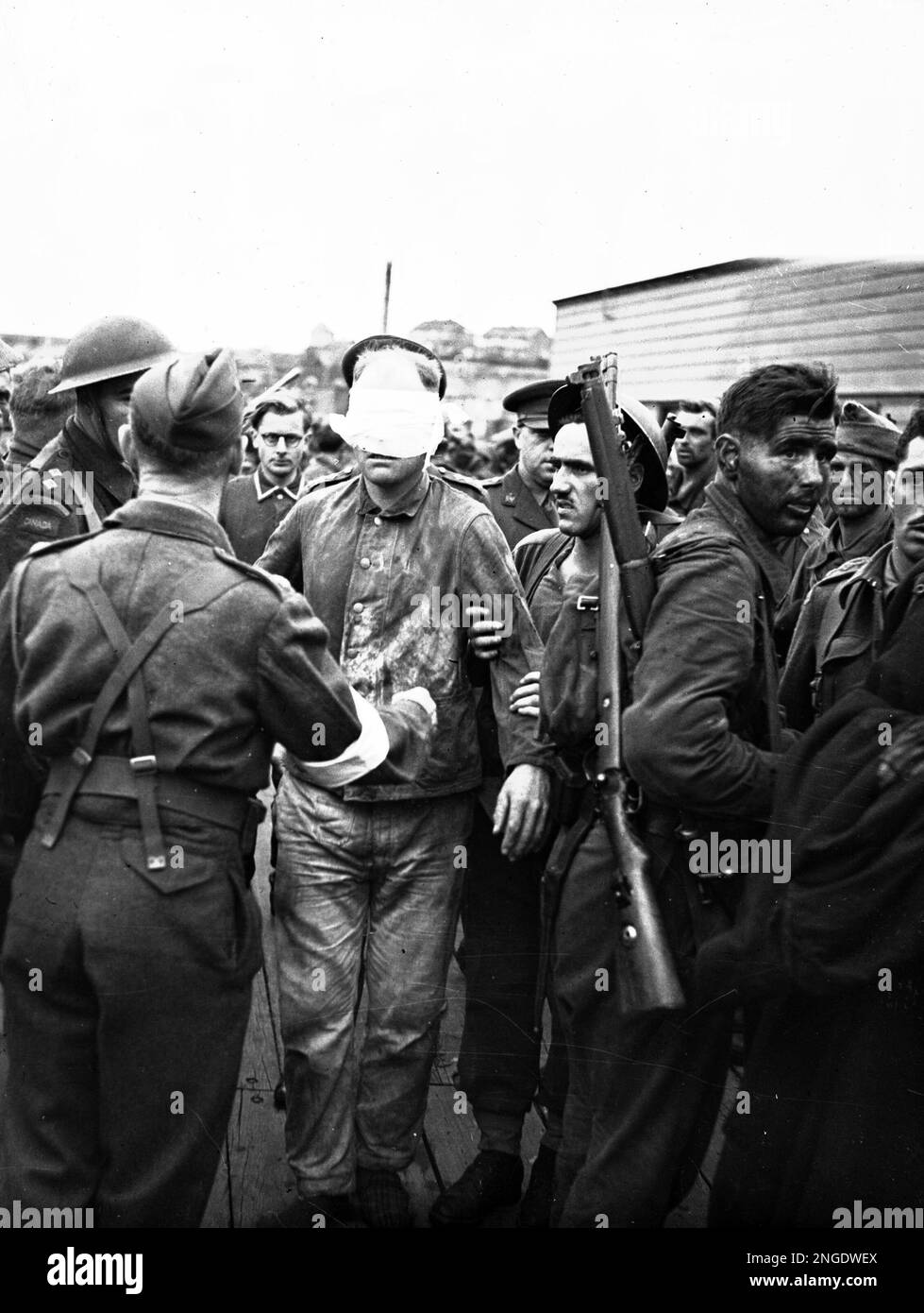 German prisoners arrive in Britain after a Combined Operations raid on ...