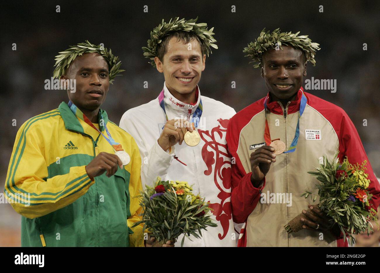 Men's 800 meter gold medalist Yuriy Borzakovskiy, centre, is flanked by ...