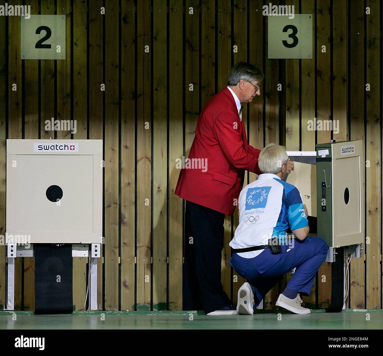Derek Ivy, chairman of the classification jury, left, removes the ...