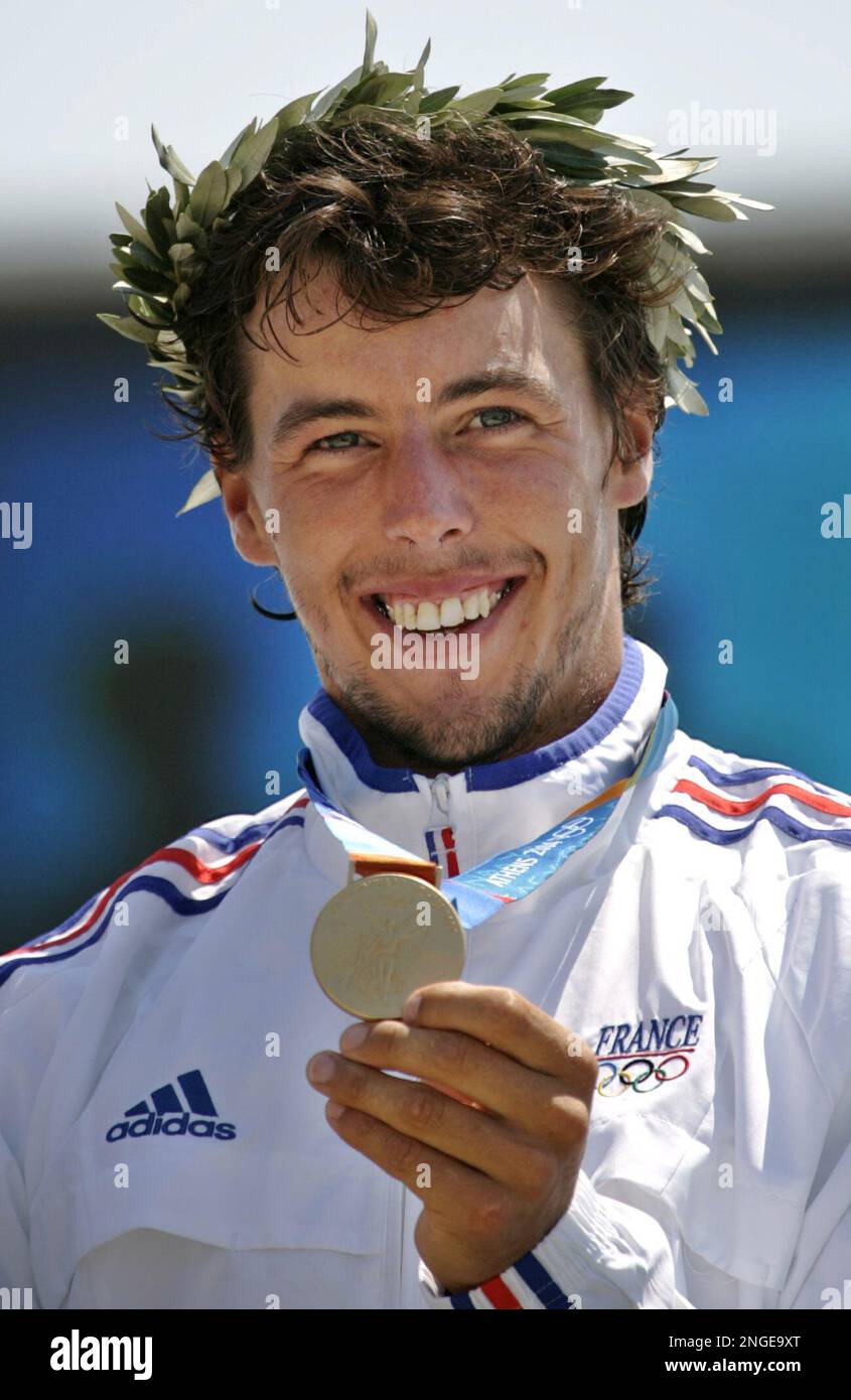 Gold medalist Benoit Peschier of France shows his medal during the ...