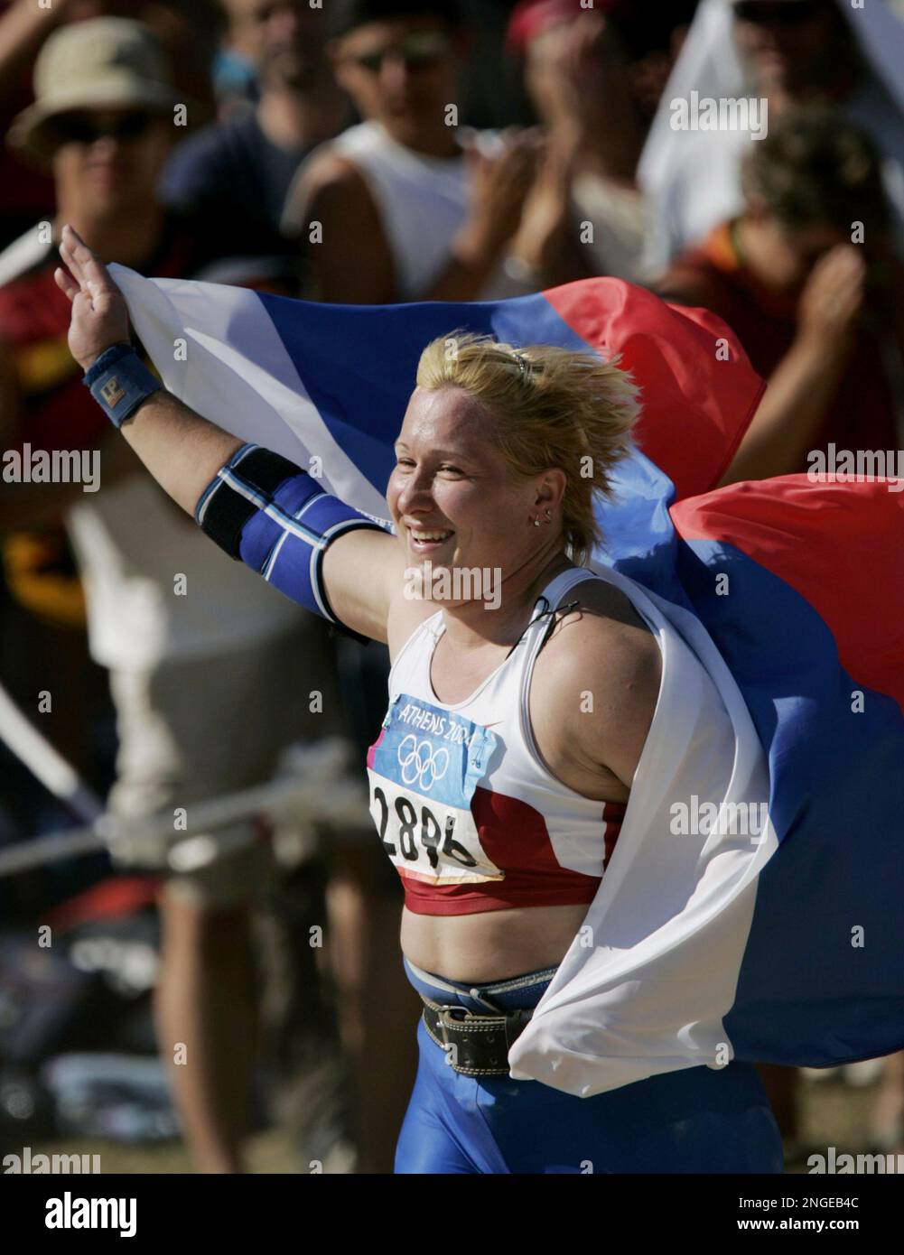 Russia's Irina Korzhanenko takes a victory lap around the ancient ...