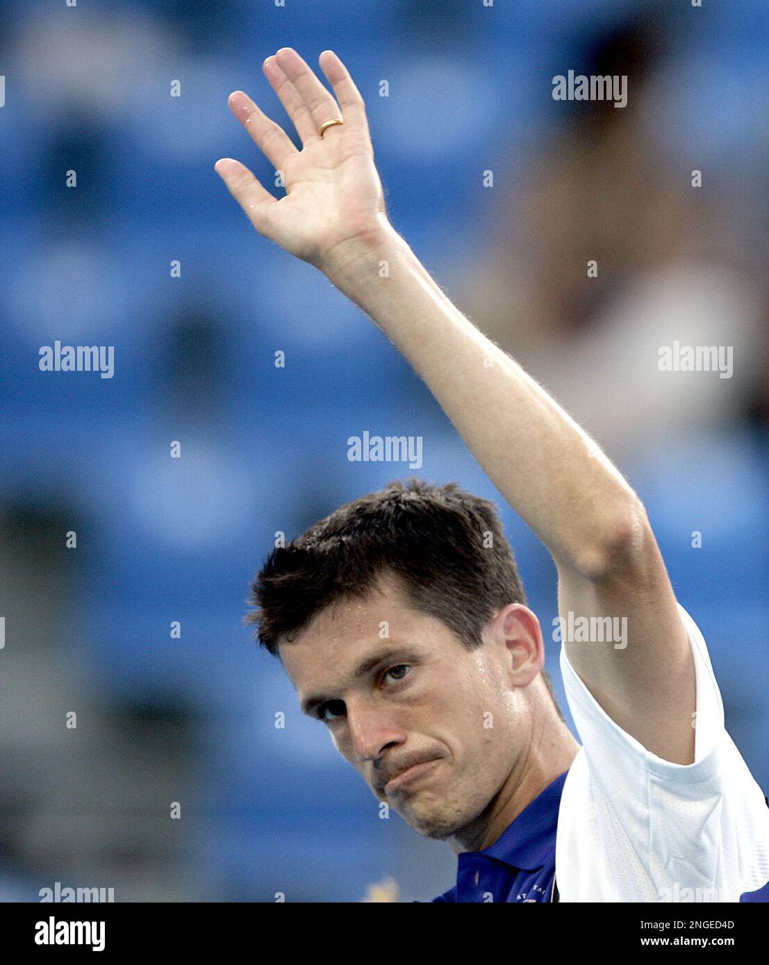 Great Britain's Tim Henman waves goodbye to the crowd after losing to ...