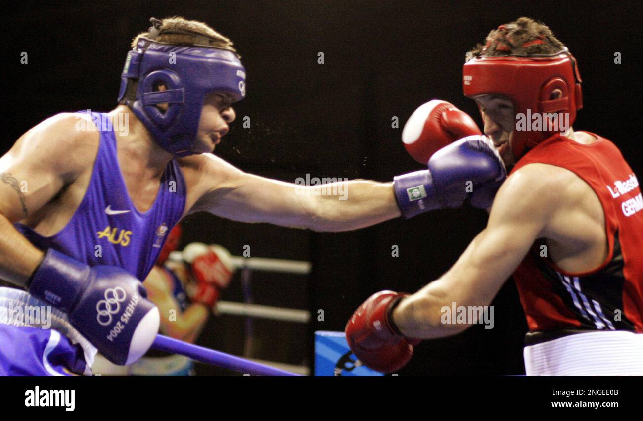 Australia's Jamie Pittman, left, lands a blow on Germany's Lukas ...