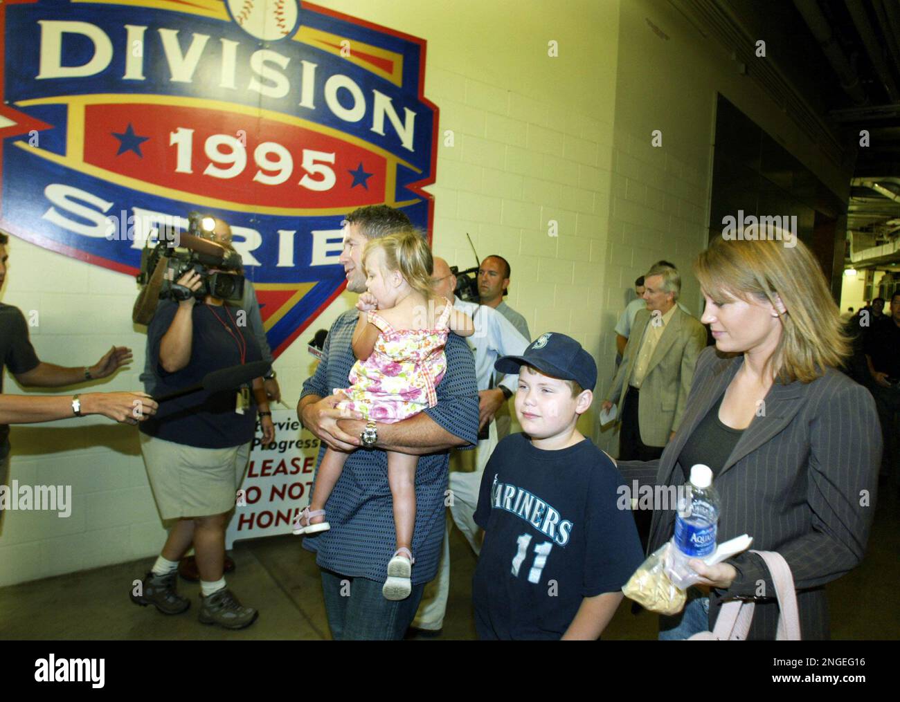Seattle Mariners designated hitter Edgar Martinez, left, holds his ...