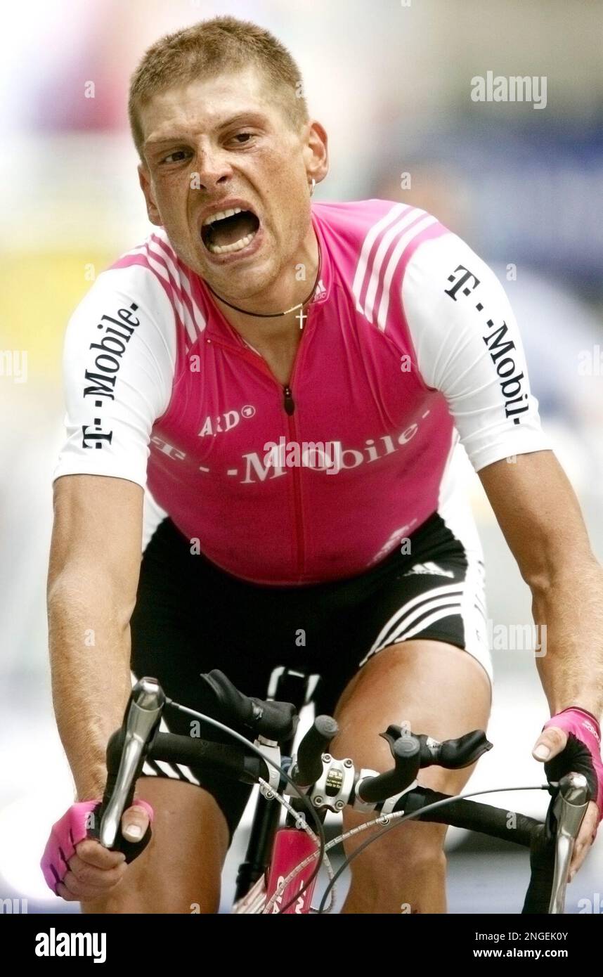 Jan Ullrich of Germany catches his breath after crossing the finish ...