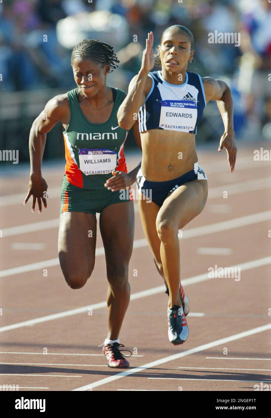 Lauryn Williams, left, and Torri Edwards cross the finish line in the ...