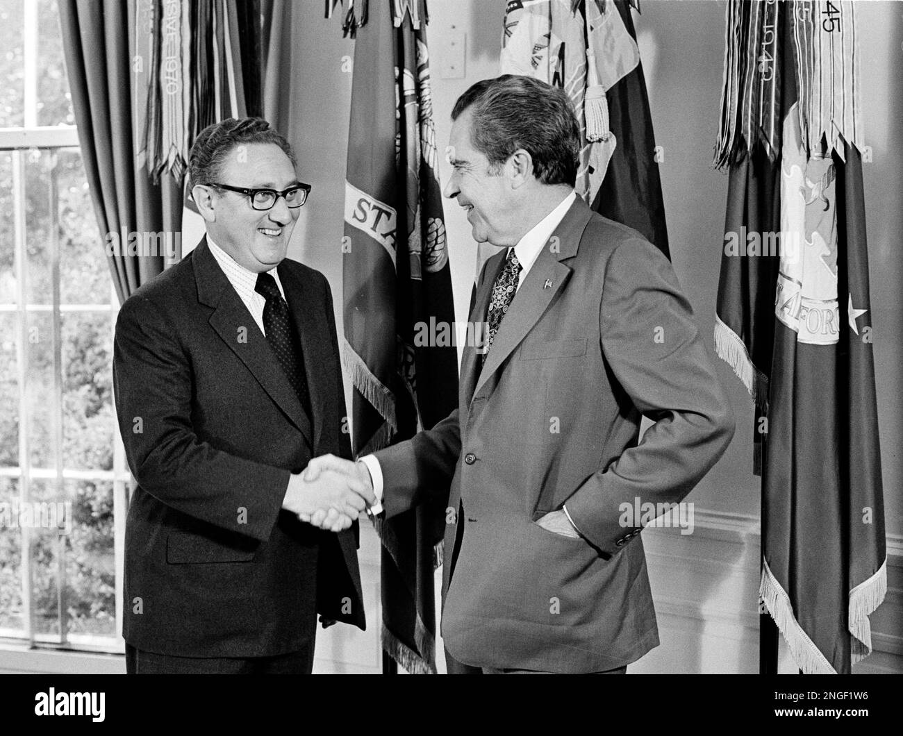 U.S. President Richard M. Nixon, right, congratulates Secretary of ...