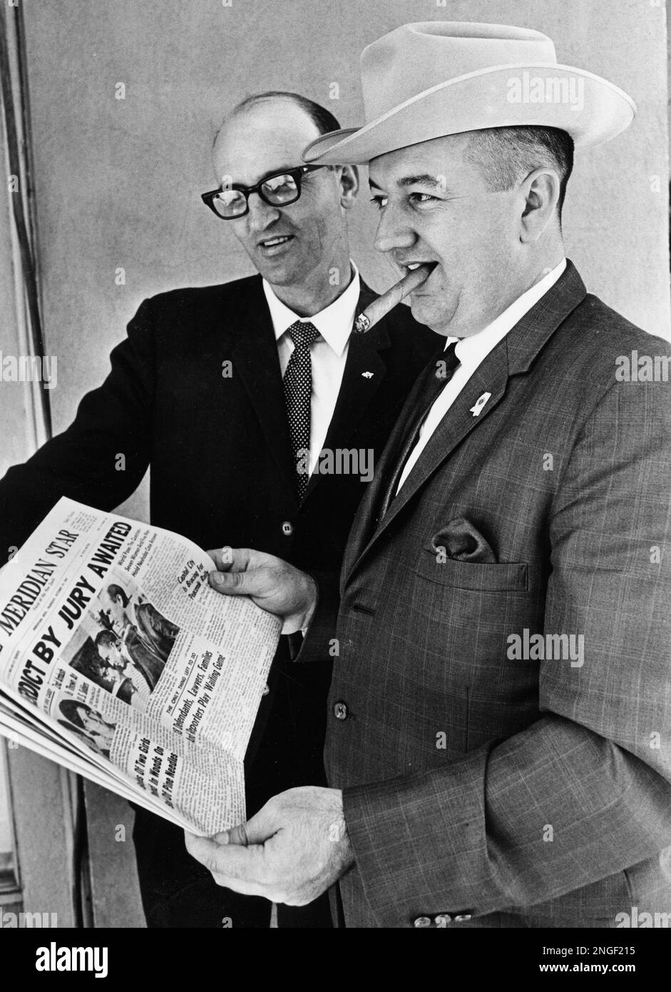 Neshoba County Sheriff Deputy Cecil Price holds a copy of the Meridian ...