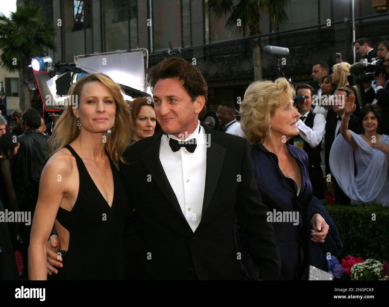 Oscar nominee Sean Penn, center, smiles as he and his wife, actress ...