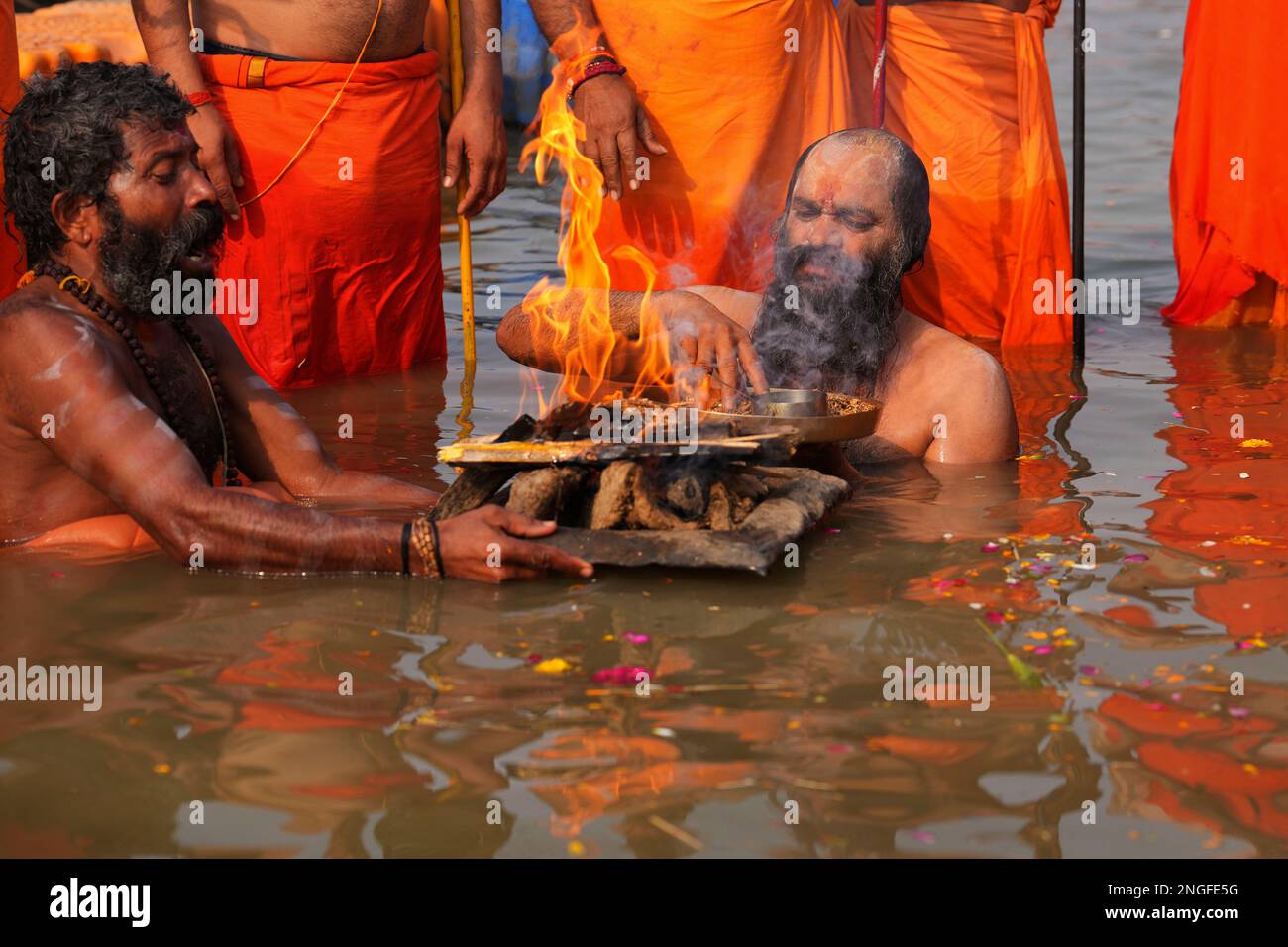 A Sadhu, or Hindu holy man Mauni Baba, offers prayers at the Sangam ...