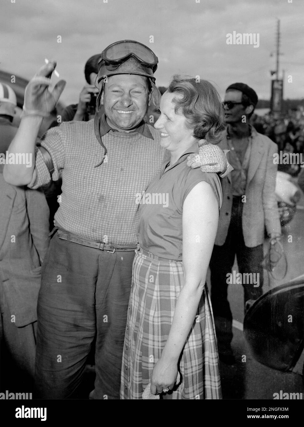 Duncan Hamilton, dirty but happy, hugs his wife after winning the Le ...