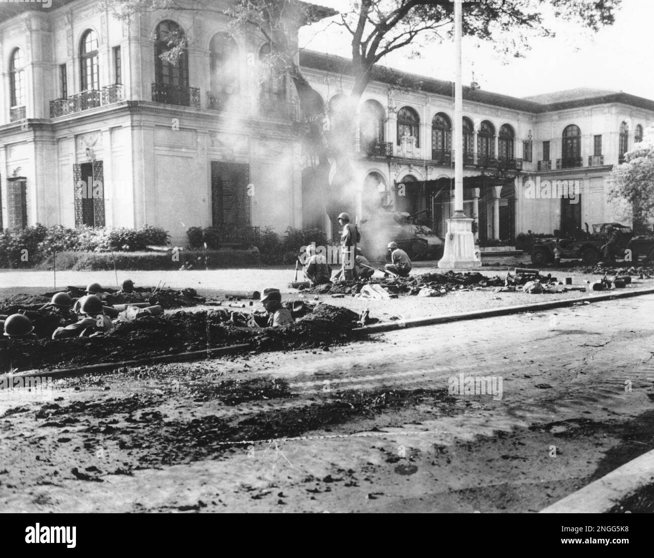 U.S. mortar crews and riflemen attack Japanese entrenchments on the ...