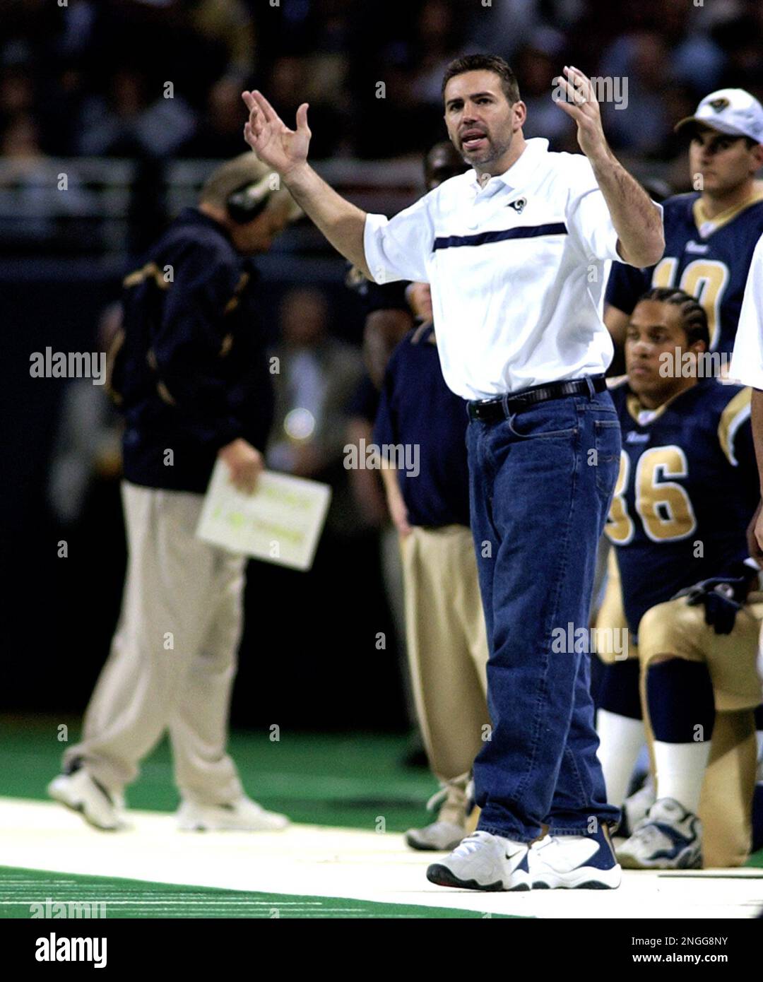 St. Louis Rams' Kurt Warner gestures to the field from the sidelines in ...