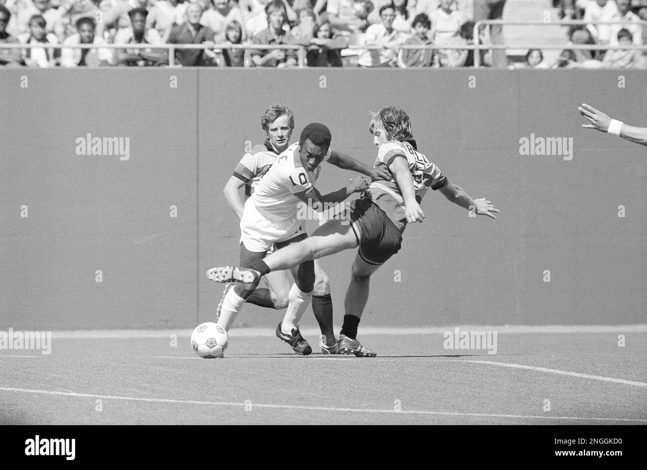 New York Cosmos' Pele (10) is seen heading for the ball despite ...