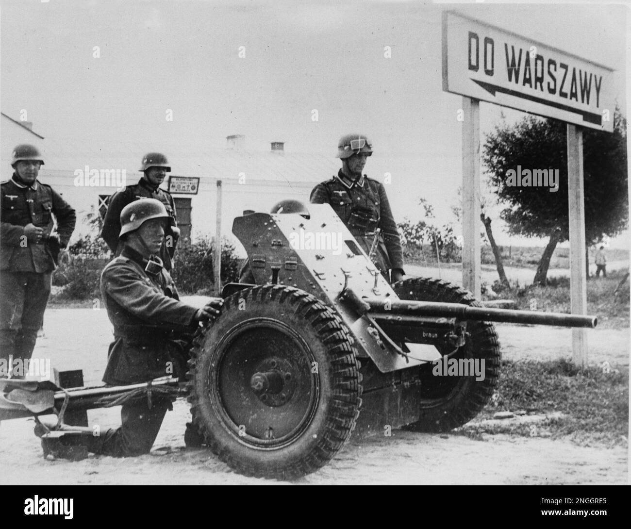 A German anti-tank gun is brought in position on the mainroad outside ...