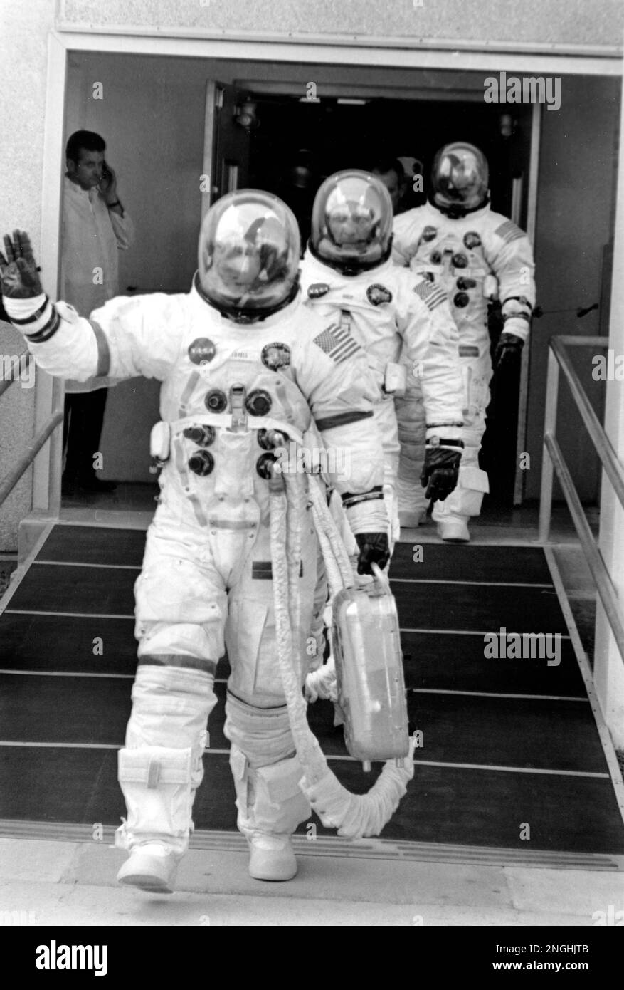 The crew of the Apollo 13 lunar landing mission are shown in their ...