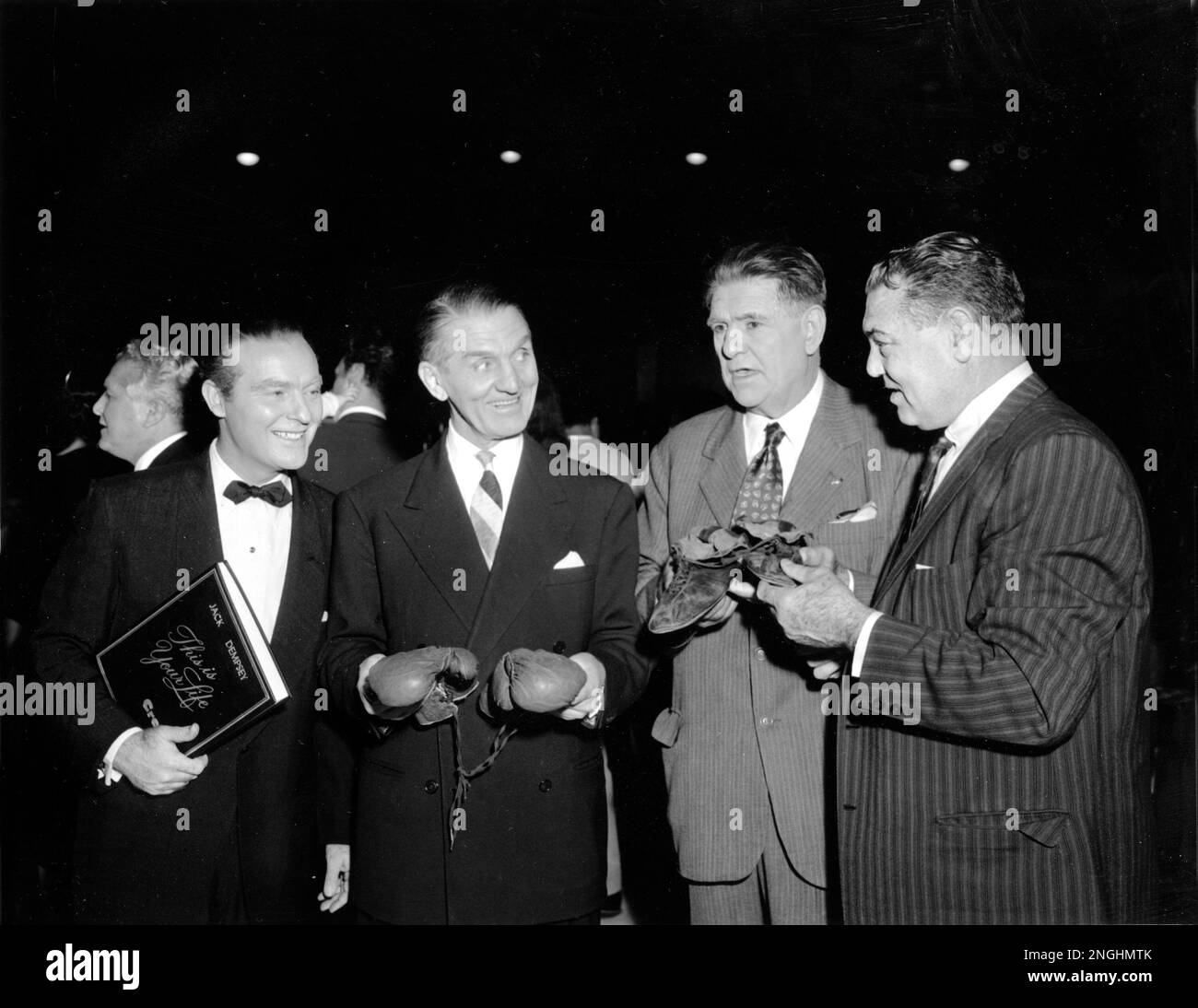 Former heavyweight champion Jack Dempsey, far right, is photographed ...
