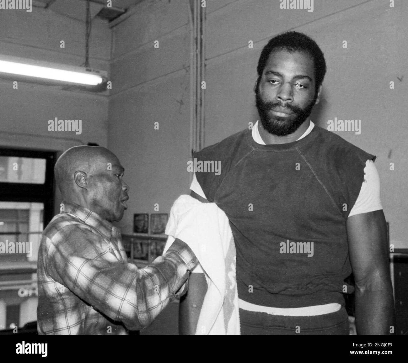 Ed "Too Tall" Jones, former Dallas cowboys football player, gets a rubdown from trainer Murphy ...