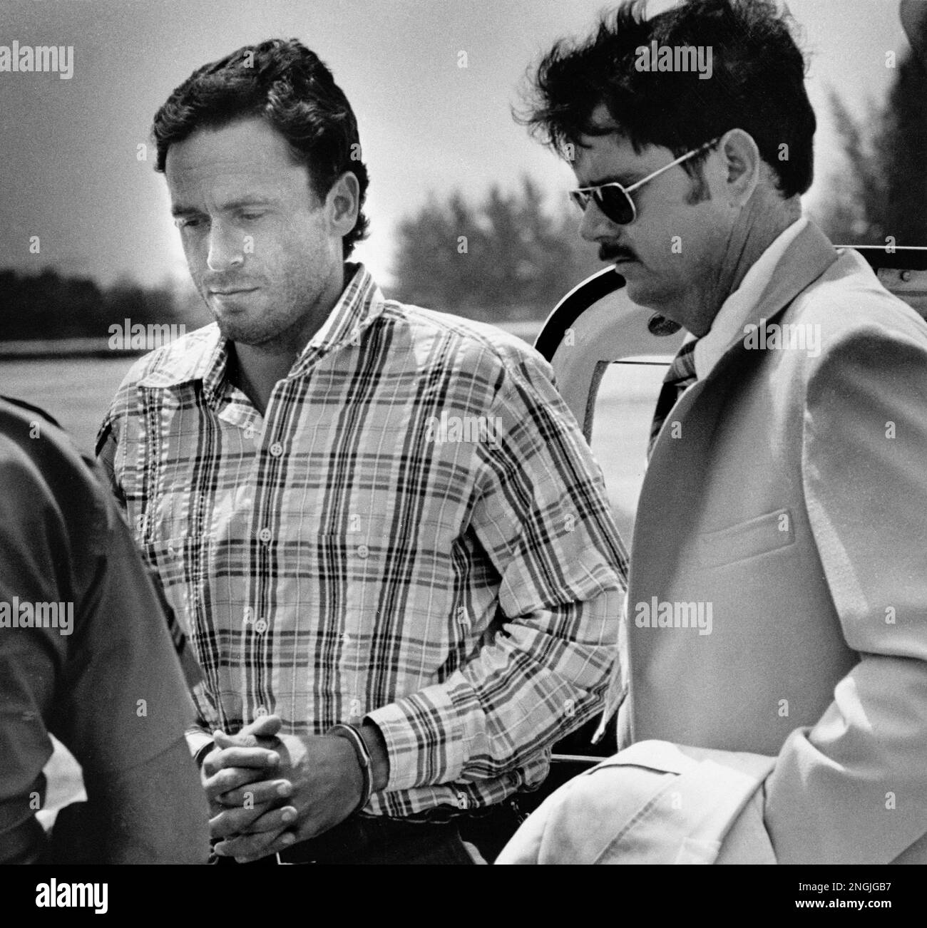 Accused murderer, Theodore Robert Bundy, left, accompanied by Leon ...