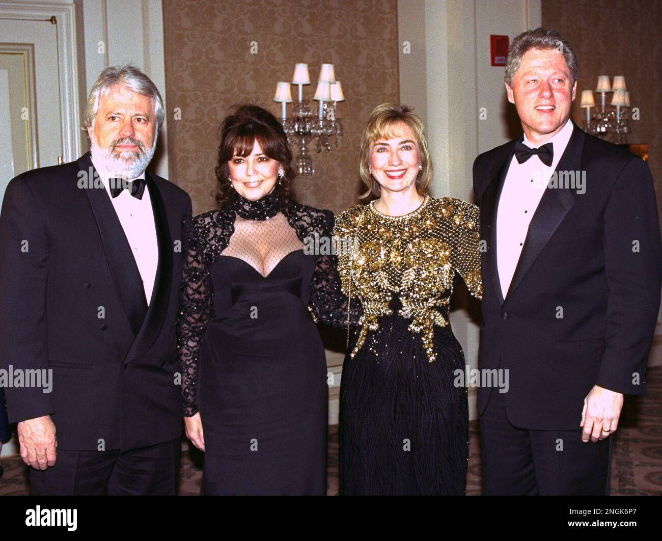 President-elect Bill Clinton, right, and his wife Hillary, second from ...