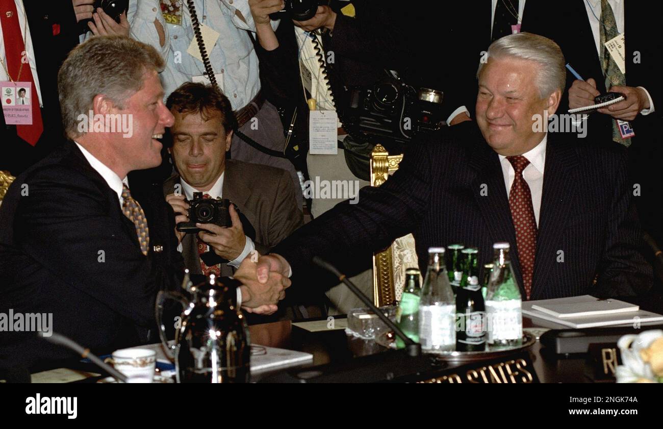 Presidents Clinton and Boris Yeltsin exchange greetings at the ...