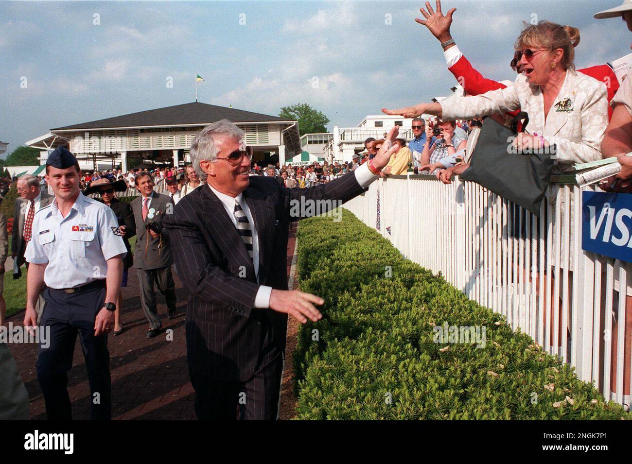 Trainer D. Wayne Lukas is greeted after his horse, Grindstone, won the ...