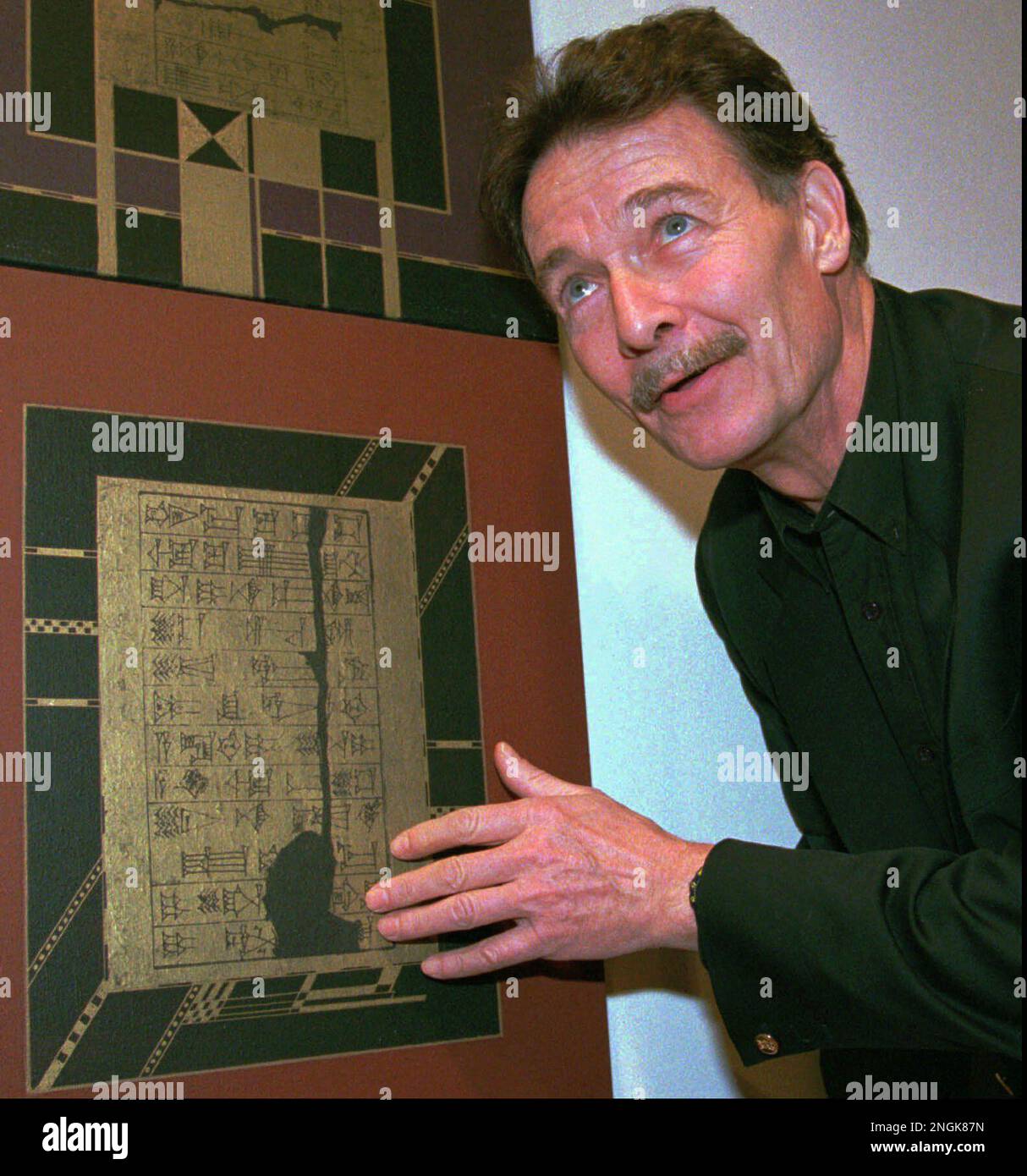 FILE--French painter Jacques Charrier shows his drawing inspired by the Hammurabi's code of 282 ...