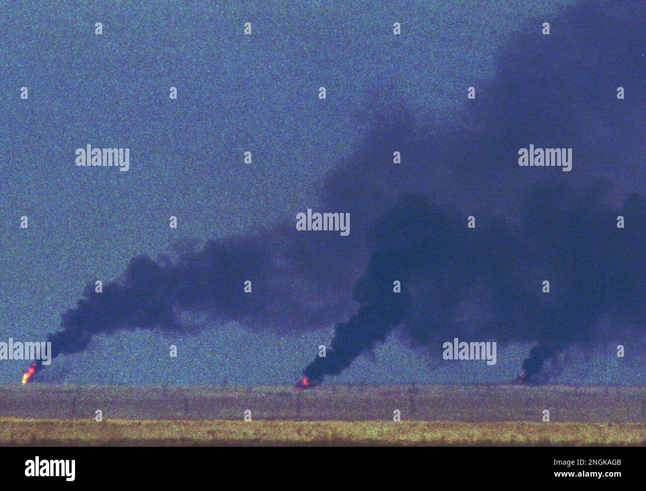 FILE--Huge columns of smoke rise above southern Kuwait where a large ...